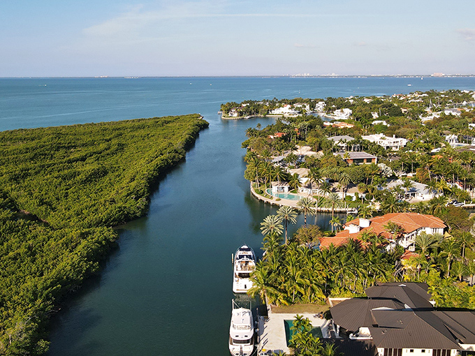 Key Biscayne's aerial view reveals its perfect position between Biscayne Bay and the Atlantic Ocean, with Miami's skyline visible in the distance.