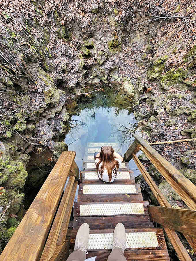 Madison Blue Springs' wooden staircase invites visitors down to one of Florida's most pristine swimming holes, a perfect circle of sapphire water.