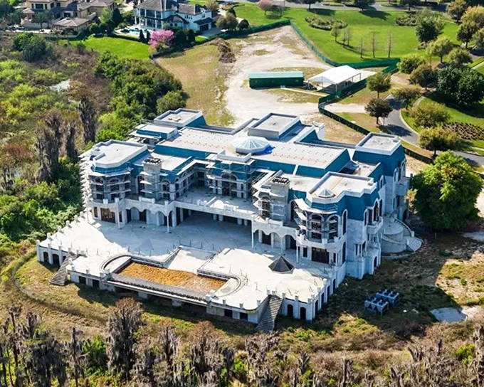 Versailles mansion sprawls across its massive property, its white fa&ccedil;ade and multiple wings showcasing one of America's most ambitious private homes.