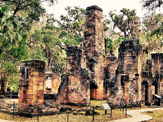 Sunlight filters through the ancient arches of the sugar mill, creating an atmospheric scene worthy of a Gothic novel.