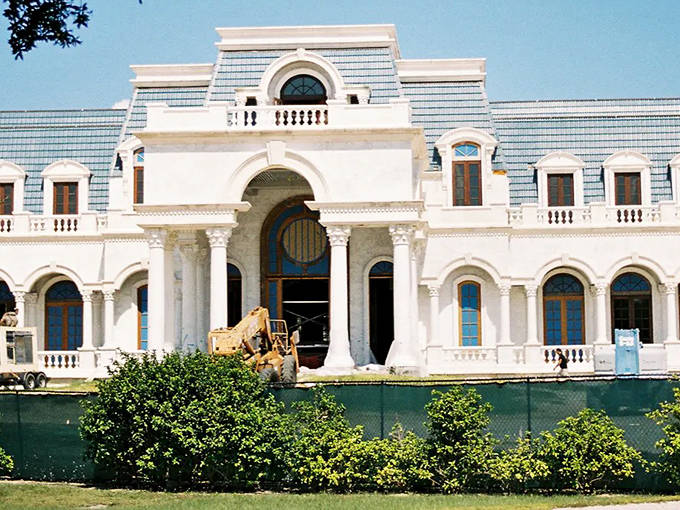 This palatial residence under construction reveals its grand entrance and classical architectural elements inspired by its famous French namesake.