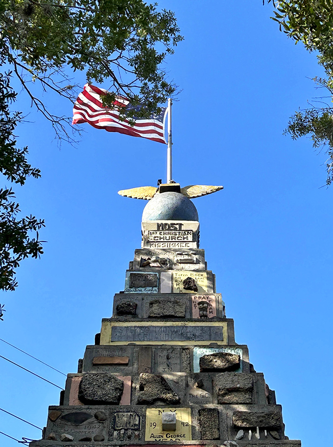 Old Glory waves proudly above the monument, adding a perfect patriotic flourish to this already star-spangled stone tower.