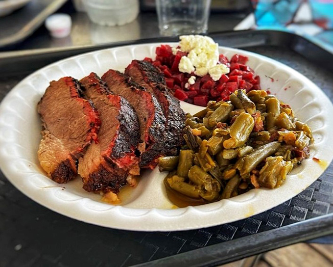 Brisket so perfectly sliced it deserves its own Instagram account, with sides that refuse to be overshadowed by the meaty main attraction.