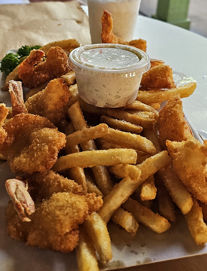 Beer-battered fish and chips with a side of creamy dipping sauce &ndash; golden, crunchy perfection that tastes like vacation.