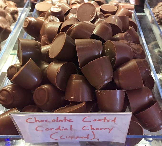 Premium chocolates arranged with museum-quality precision make choosing just one feel like an impossible mission you're happy to accept.