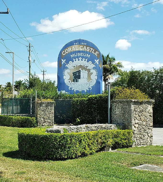 The vintage Coral Castle sign welcomes visitors to a place where physics took a vacation and one man's heartbreak became everyone's fascination.
