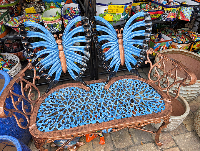 The butterfly bench that whispers, "Sit a spell" &ndash; where garden conversations take flight and coffee tastes just a bit more magical.