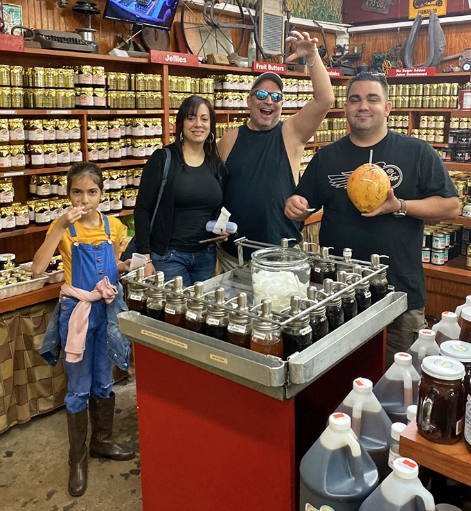 Happy visitors celebrate their fruity discoveries, coconut in hand &ndash; the universal expression of "we've found paradise!"