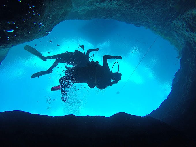 Silhouettes against the deep blue create dramatic scenes, reminding us that sometimes the best adventures happen where sunlight fears to tread.