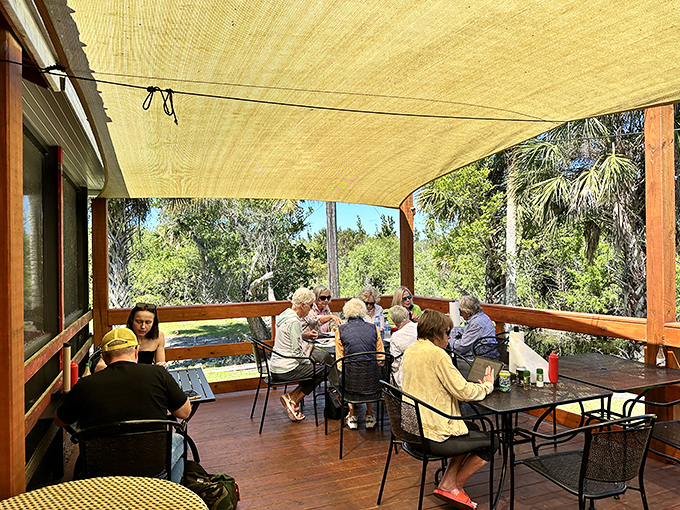 The covered porch provides a front-row seat to nature's show &ndash; diners linger over meals while enjoying the gentle Everglades breeze.
