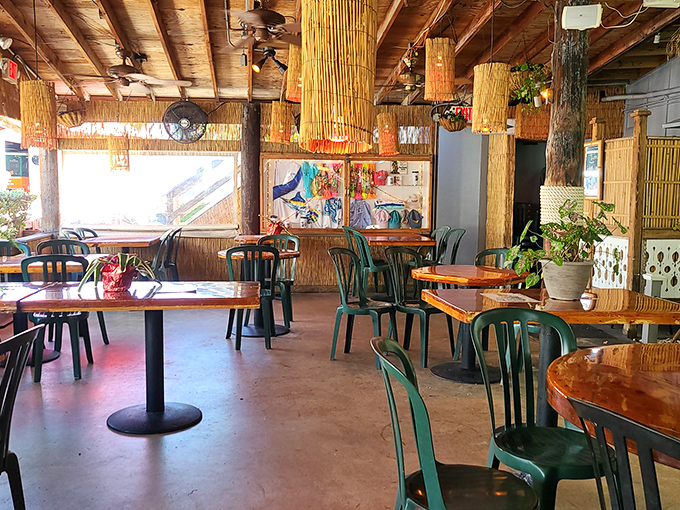 Dining Area: Bamboo light fixtures cast a warm glow over wooden tables where countless vacation stories have been shared and seafood demolished.