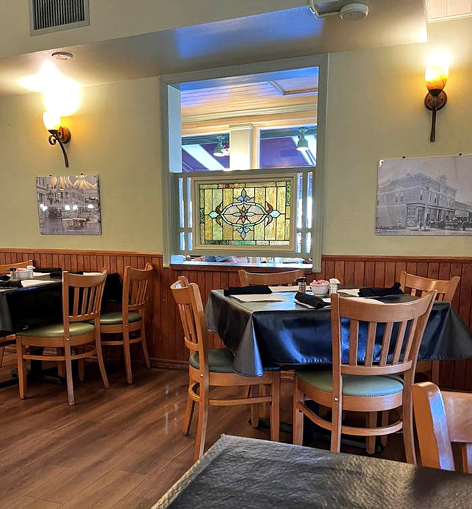 Soft lighting, wood paneling, and comfortable seating create the perfect backdrop for lingering conversations and second helpings of everything.