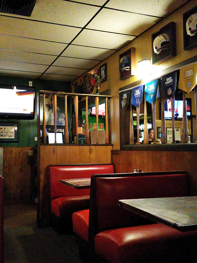 The dining area whispers stories of celebrations past while inviting you to create your own memories among the wood paneling and sports memorabilia.