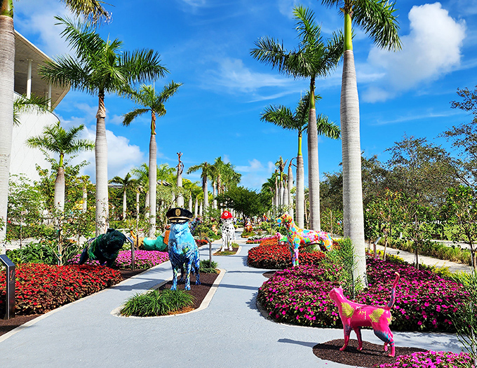 Colorful animal sculptures play hide-and-seek among tropical blooms in the garden, bringing whimsy to the museum's sophisticated grounds.
