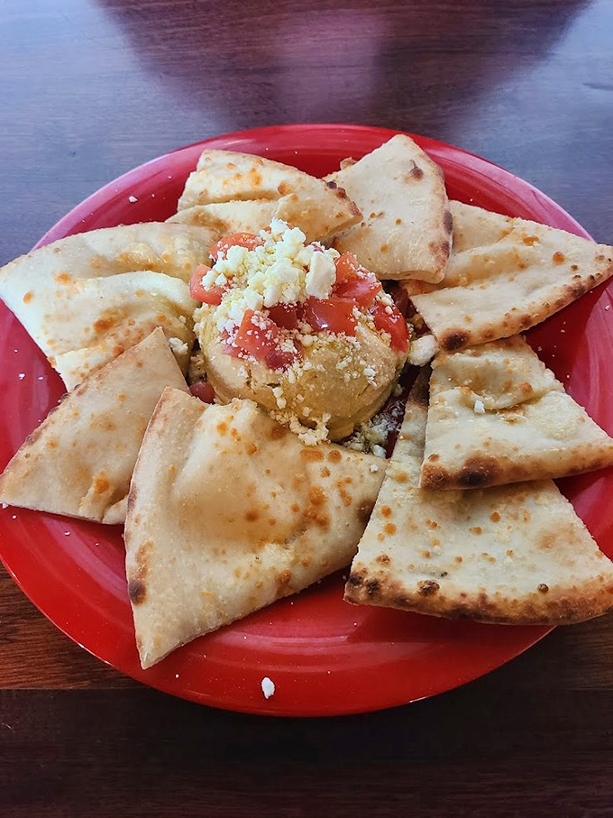 This hummus plate isn't just food &ndash; it's an edible work of art that makes waiting for your pizza a pleasure, not a punishment.