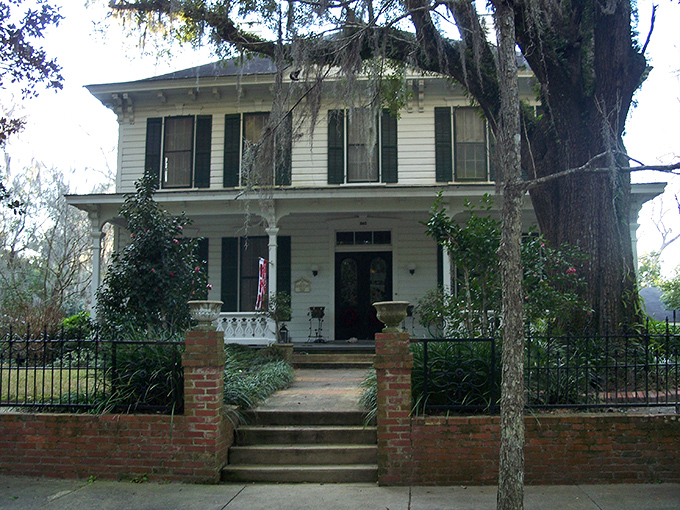The Girardeau-Durst House stands with elegant proportions that speak to an era when carpenters were artists and homes were built to last centuries.