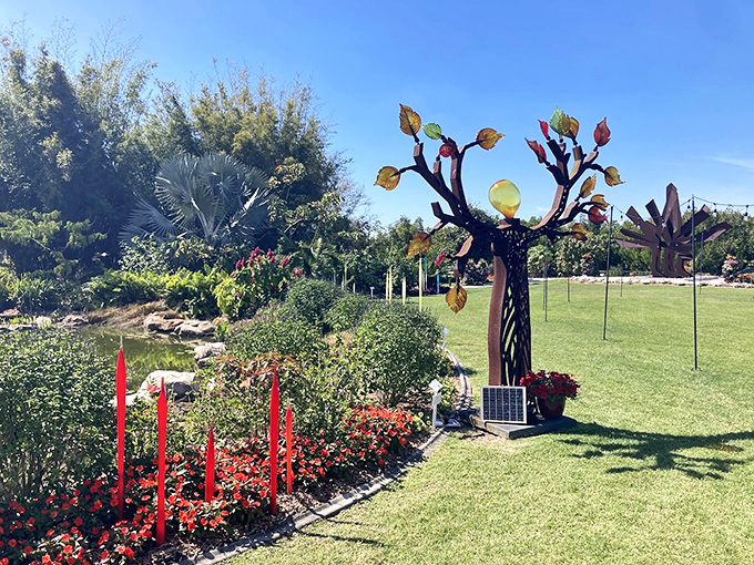 Glass leaves catch sunlight like captured rainbows on this sculptural tree that never needs watering, only admiration.