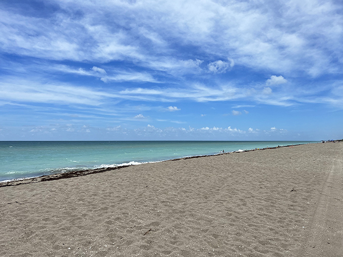 Sand meets sky in a horizon-bending panorama that reminds us why we fell in love with beaches.