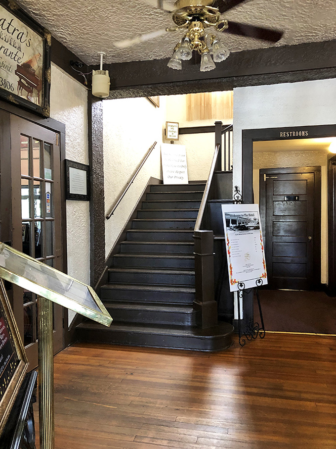 Each step creaks with history and possibly warnings. The staircase has witnessed a century of comings, goings, and occasional floating apparitions that defy the laws of physics.