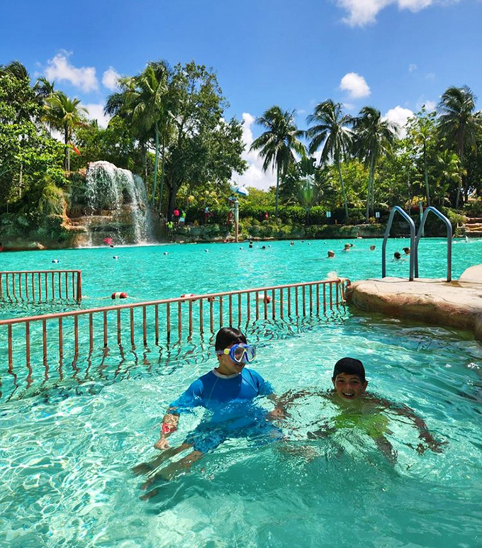 Children discover the joy of swimming in a setting that feels more like a natural lagoon than a man-made pool, creating memories that will last a lifetime.