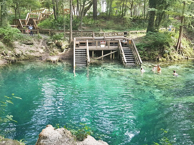 Main Spring Pool Lower Deck View: The wooden platform offers front-row seats to nature's greatest water show &ndash; 55 million gallons daily bubbling up from underground.