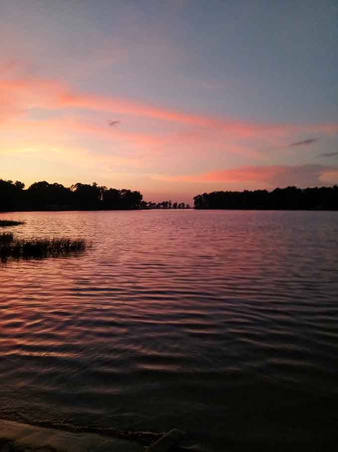 Sunsets here paint the sky in colors that would make Bob Ross reach for extra brushes, reflecting perfectly on the glassy water below.