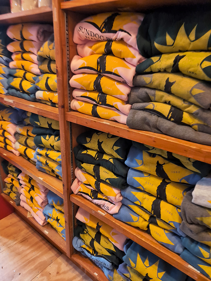 Colorful stacks of Sundog merchandise &ndash; these aren't just souvenirs but badges of honor for the bibliophile tribe. Wear your book love proudly!