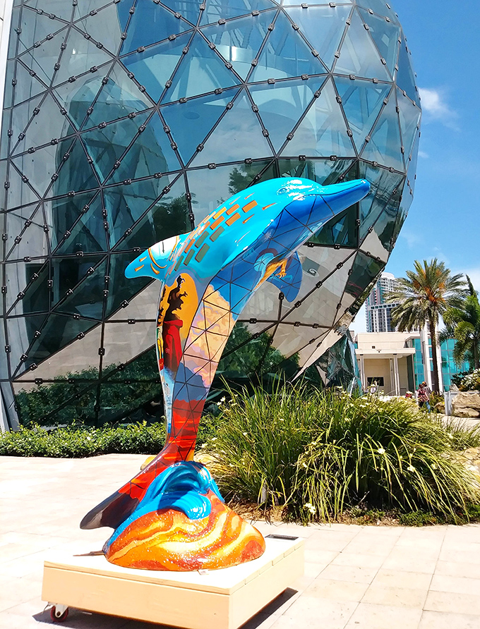 This vibrant dolphin sculpture outside the museum proves that even marine life isn't immune to Dal&iacute;'s colorful influence.