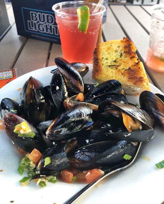 Fresh mussels arrive ready to impress, their dark shells hiding tender treasures that taste like the ocean decided to throw a party.
