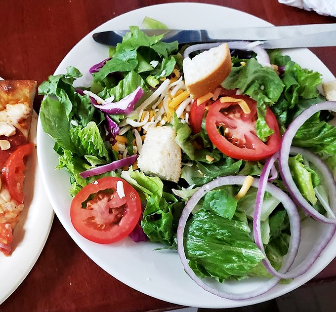 Fresh, crisp, and colorful &ndash; the token nod to nutrition that somehow manages to hold its own against pizza royalty.