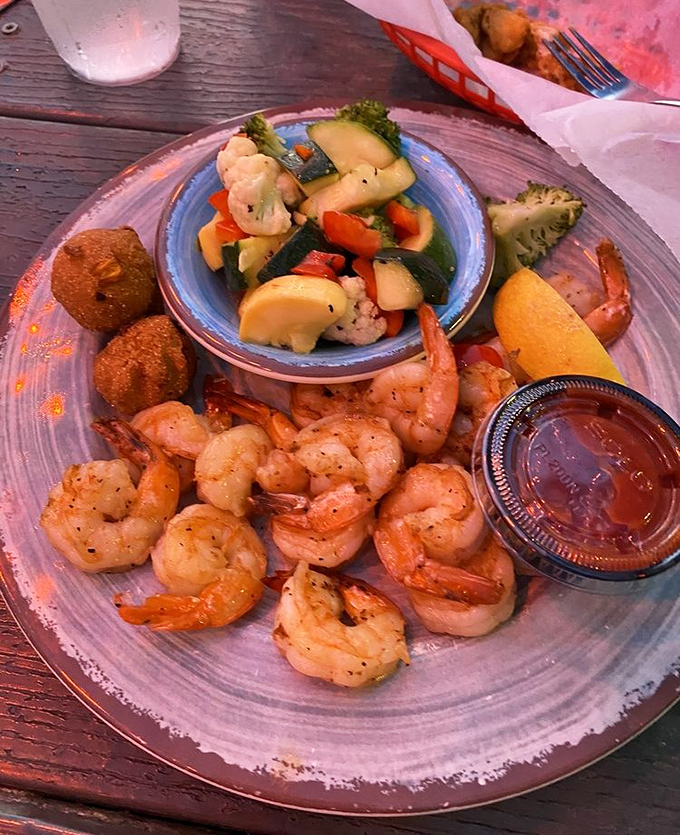 Plump, perfectly seasoned Gulf shrimp served alongside colorful steamed vegetables &ndash; proof that healthy eating can still be utterly delicious.