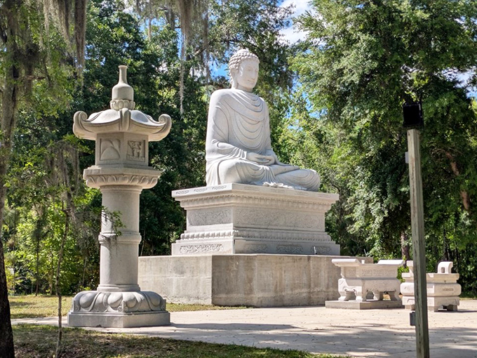 From this angle, the Buddha statue appears to gaze benevolently across the meditation garden, creating a focal point for the entire property.