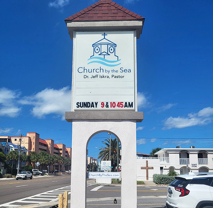 The church's sign stands as a friendly beacon, inviting passersby to Sunday services led by Pastor Dr. Jeff Iskra.