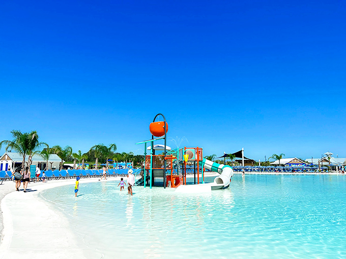Little ones splash in the children's area, where colorful slides and shallow waters create a safe playground for budding water enthusiasts.
