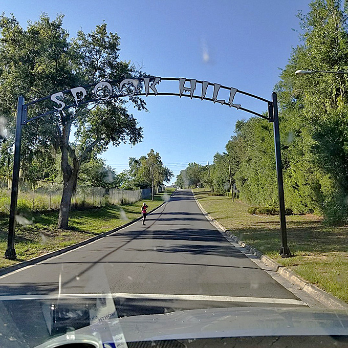 A car approaches the mysterious Spook Hill archway, about to discover whether science or supernatural forces will explain what happens next.