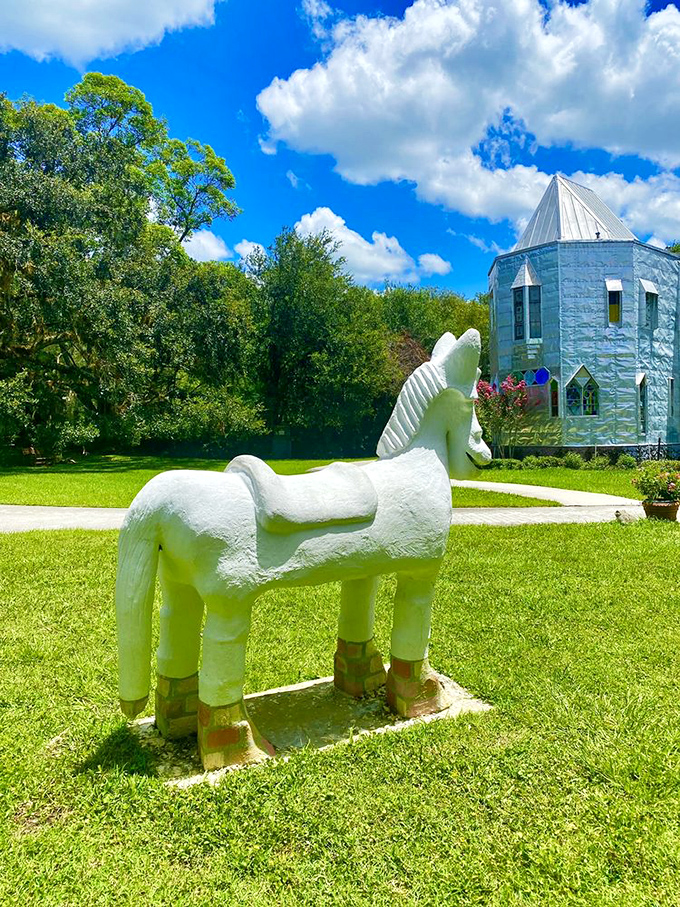 A pristine white horse sculpture stands guard on the lawn &ndash; simplicity amid complexity, like finding zen in a junkyard.