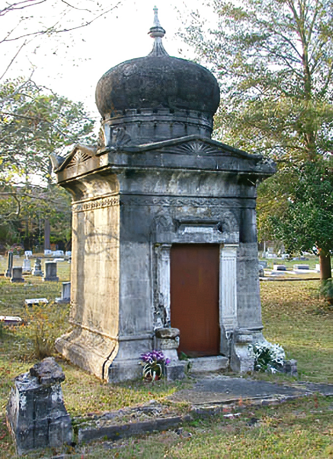 Summer greenery frames the Phillips Mausoleum, the contrast between vibrant life and eternal stone creating a poignant visual poetry.