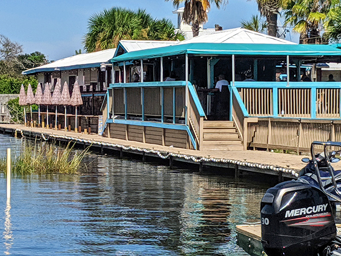 Treasure Raw Bar & Grill sits perched over the water, where seafood arrives so fresh it practically introduces itself before dinner.