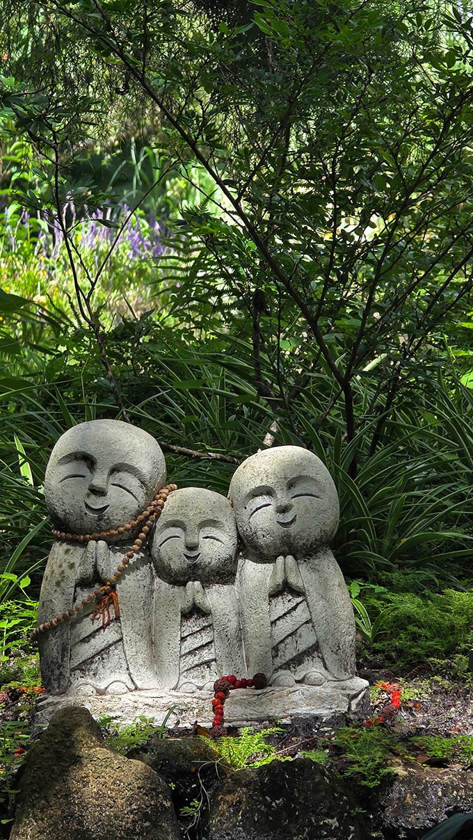 These smiling Jizō statues bring Japanese tranquility to Florida's subtropical setting. Their serene expressions suggest they've made peace with sharing garden space with dinosaurs.