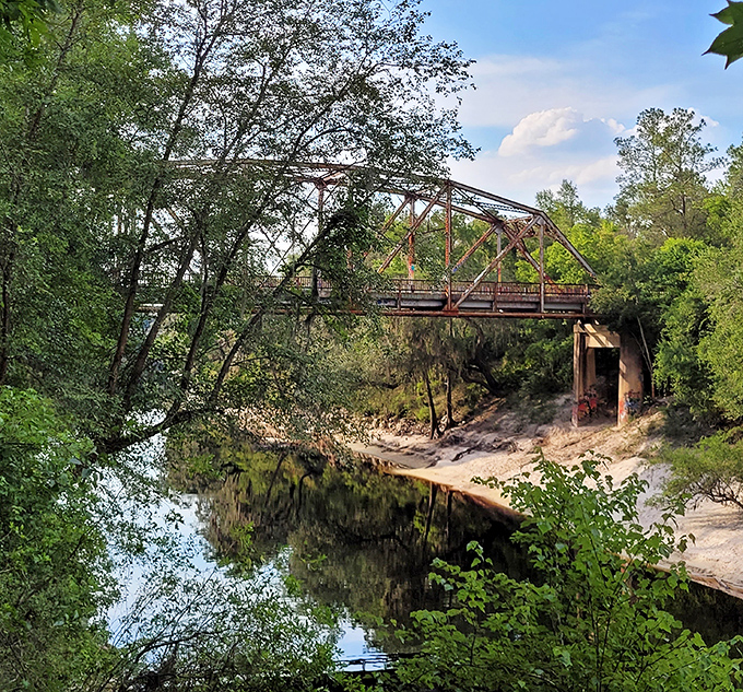 The geometric precision of engineering meets the fluid expression of street art, creating a visual tension that somehow enhances both elements.