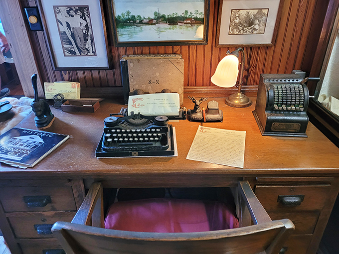 The antique desk setup captures a moment frozen in time, complete with typewriter and ledgers from when "backup files" meant carbon paper.