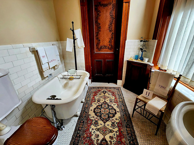 Even the bathroom is a fascinating time capsule of Victorian plumbing technology, with its claw-foot tub and pedestal sink exuding vintage charm.