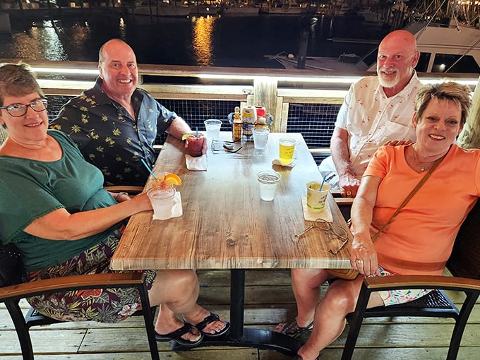 Happy diners soaking up the waterfront ambiance &ndash; the universal expression of people who've discovered their new favorite Florida spot.