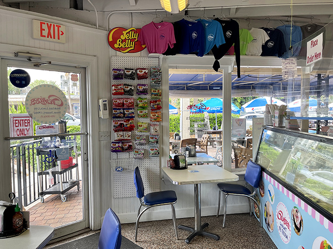 The simple dining area offers respite from Florida heat while providing front-row seats to sandwich artistry in action.