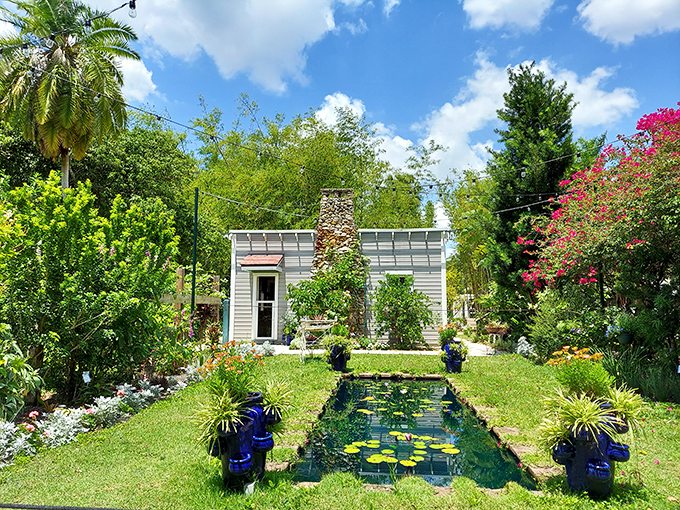 A serene lily pond surrounded by vibrant flowers creates a peaceful retreat that would make any gardener (or inventor) green with envy.