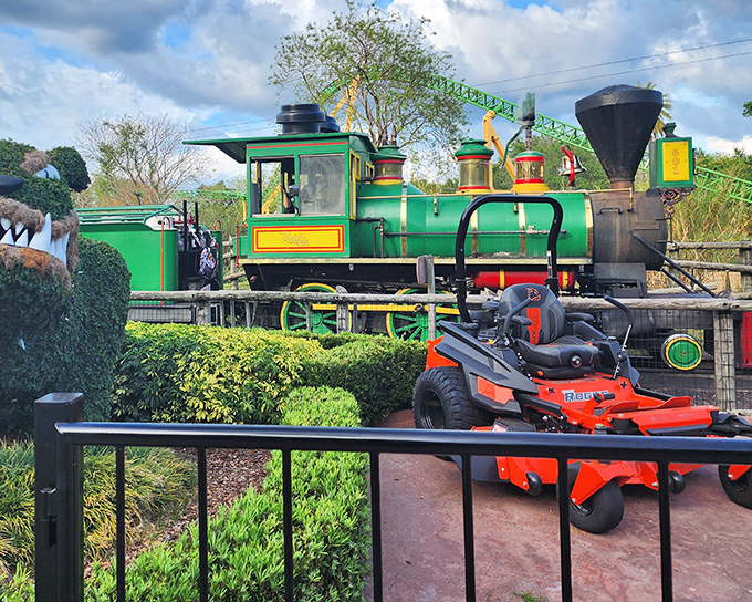 Bright green vintage train and bold orange mower pop against lush greenery, creating a vibrant, playful scene bursting with adventure energy.