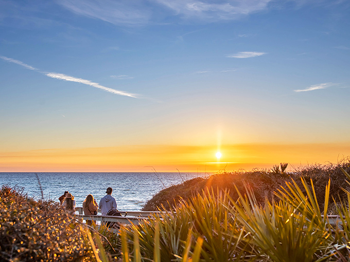 Sunset paints the Gulf waters with colors so vivid, you'll wonder if Mother Nature hired a new art director.