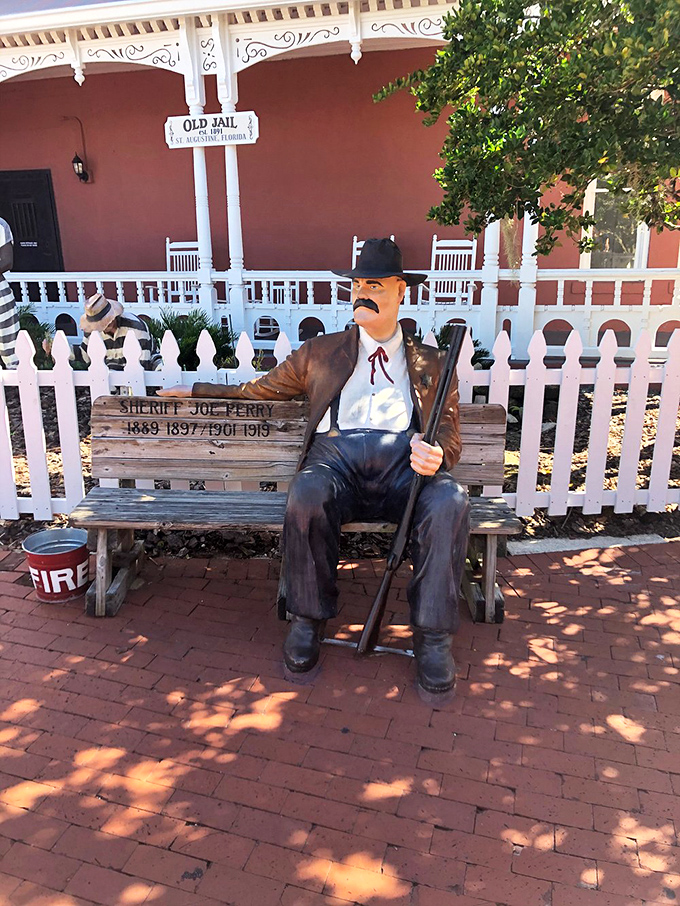 This stoic sheriff statue stands eternal watch, silently judging your fashion choices and reminding visitors who was boss in old St. Augustine.