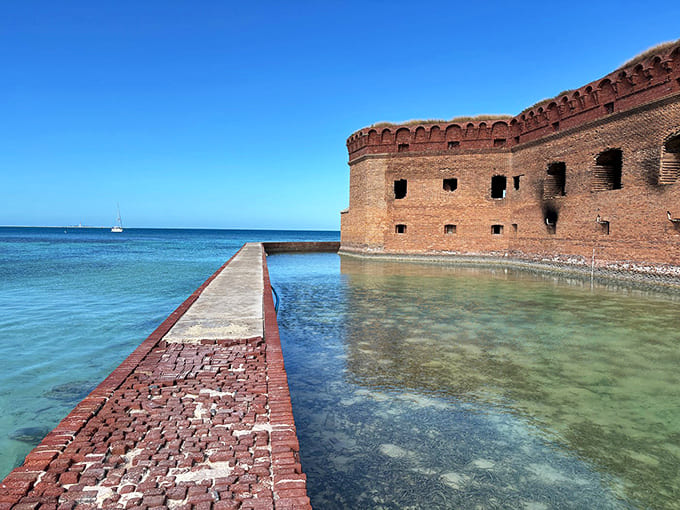 Fort Jefferson rises from the turquoise waters like a massive brick fortress, beautiful and haunting in its remote island isolation.