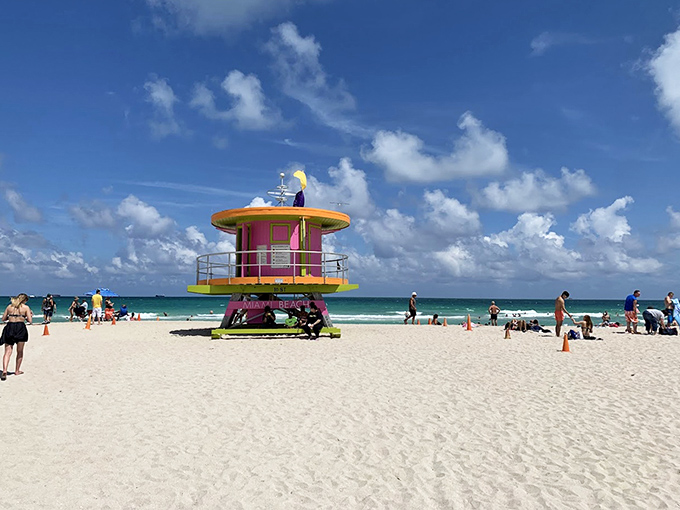 Ah, the classic South Beach scene! That colorful lifeguard stand is like an iconic pop-art sculpture welcoming everyone to the warm, white sand.